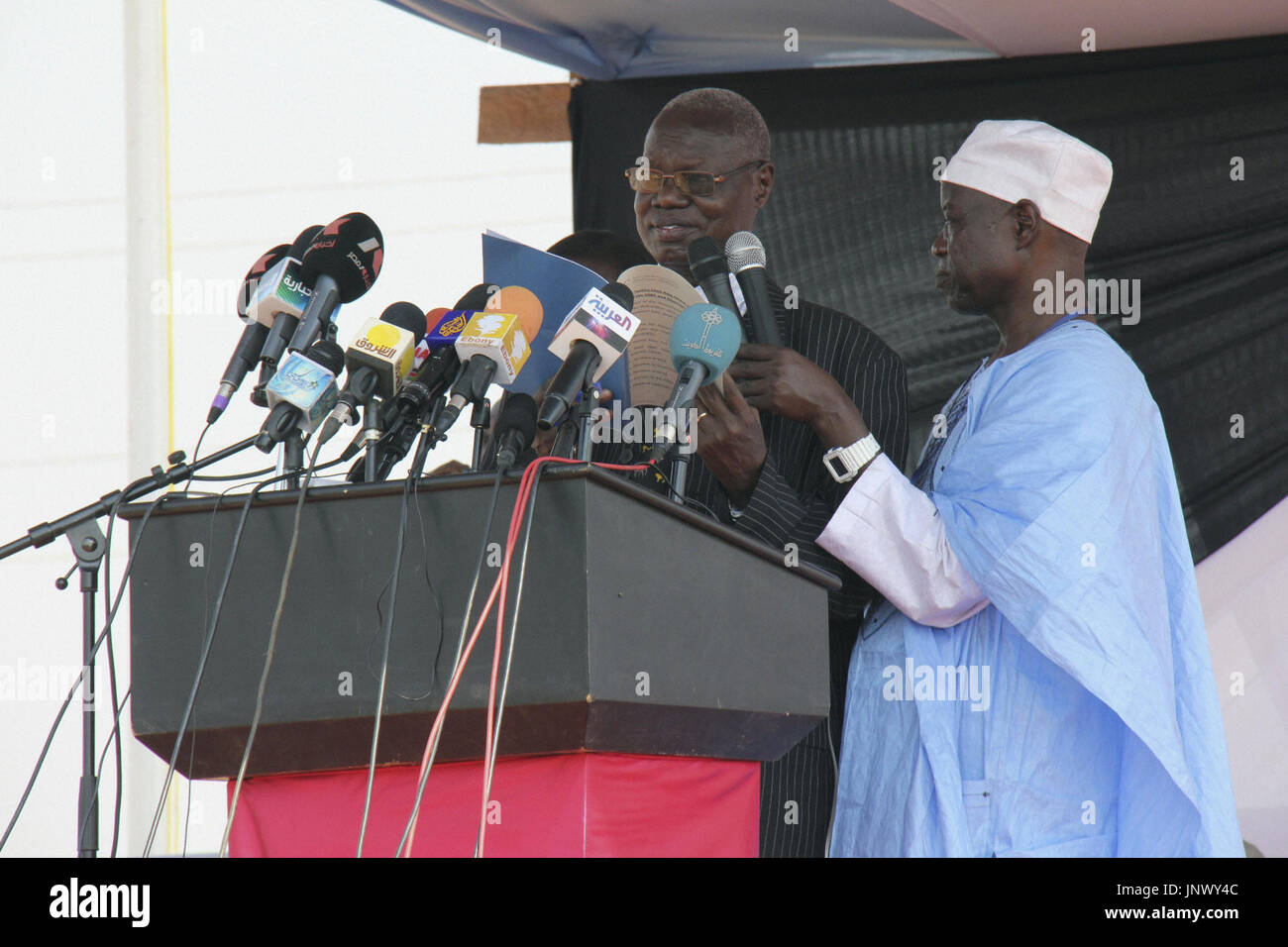 JUBA, Sudan - An official (L) of the referendum commission announces ...