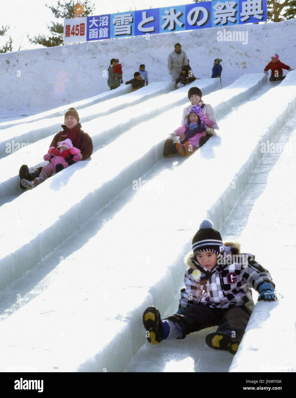 HAKODATE, Japan - People enjoy sliding down 20-meter-long slopes made ...