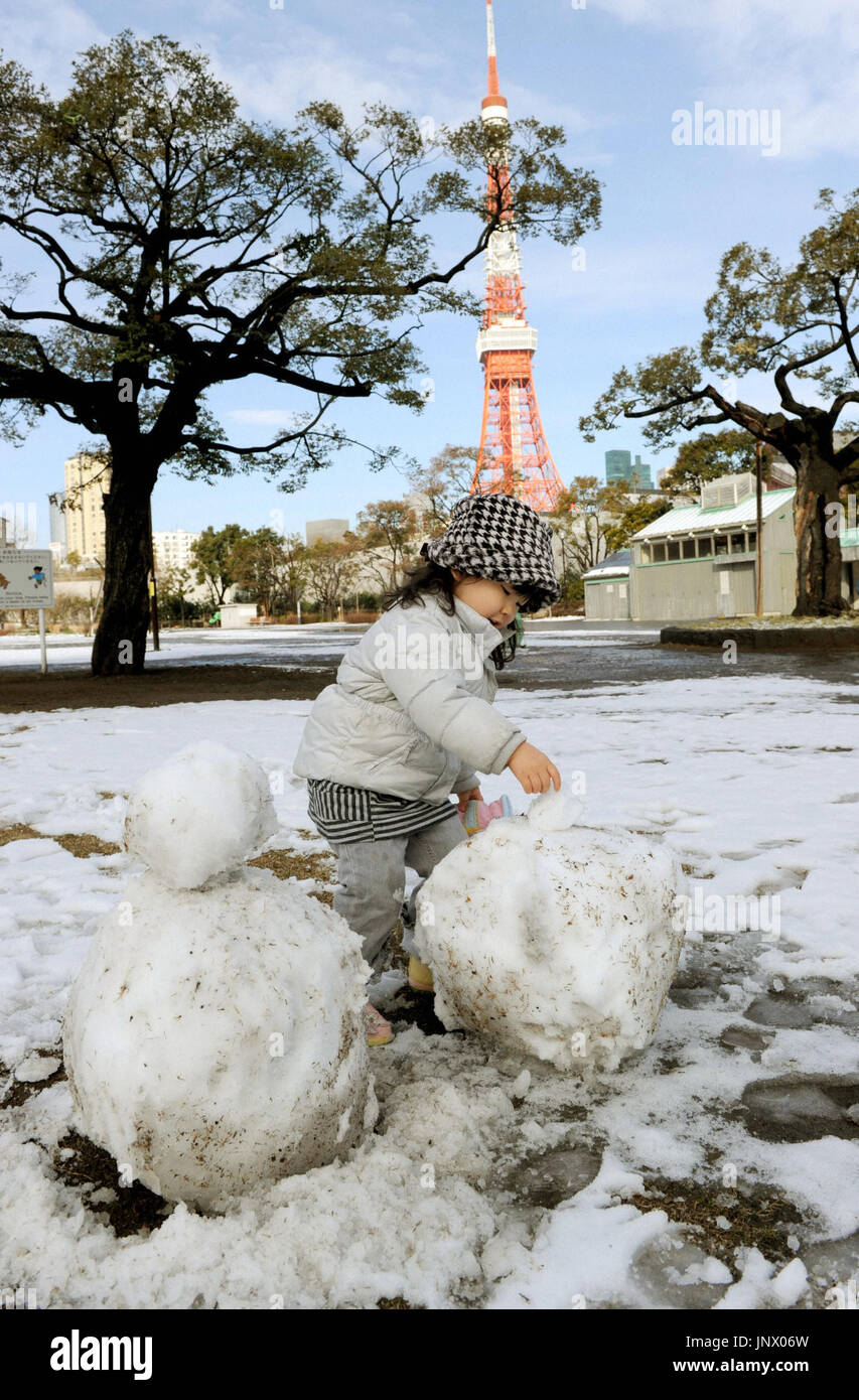TOKYO, Japan - A girl makes a snowman in Tokyo's Minato Ward on Feb. 15 ...