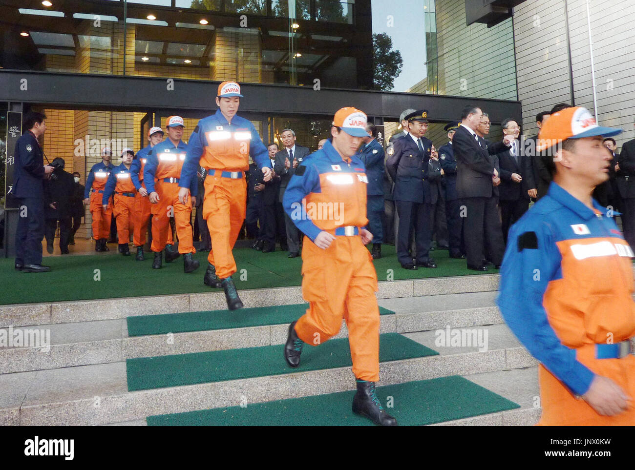 TOKYO, Japan - Police officers leave the Metropolitan Police Department ...