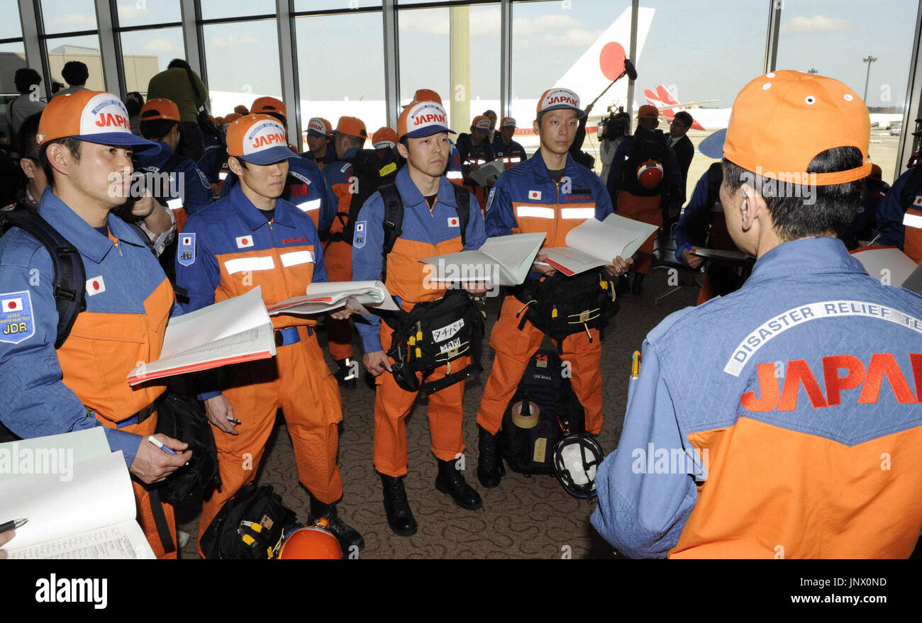 NARITA, Japan - Members of the Japanese government's emergency relief ...