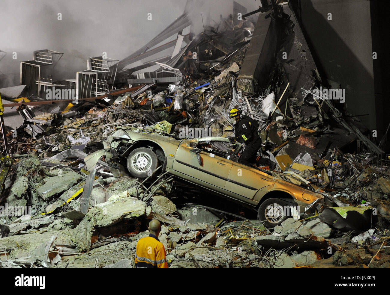 CHRISTCHURCH, New Zealand - Rescue efforts continue around a collapsed ...