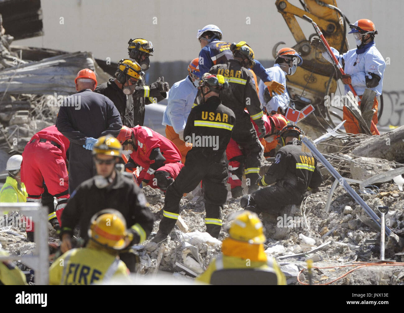 CHRISTCHURCH, New Zealand - Rescue workers search for signs of ...