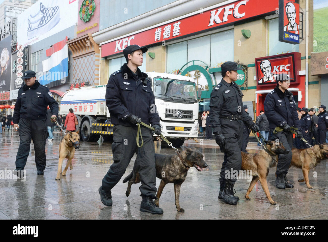 BEIJING, China - Police officers patrol a busy street in Beijing on Feb ...