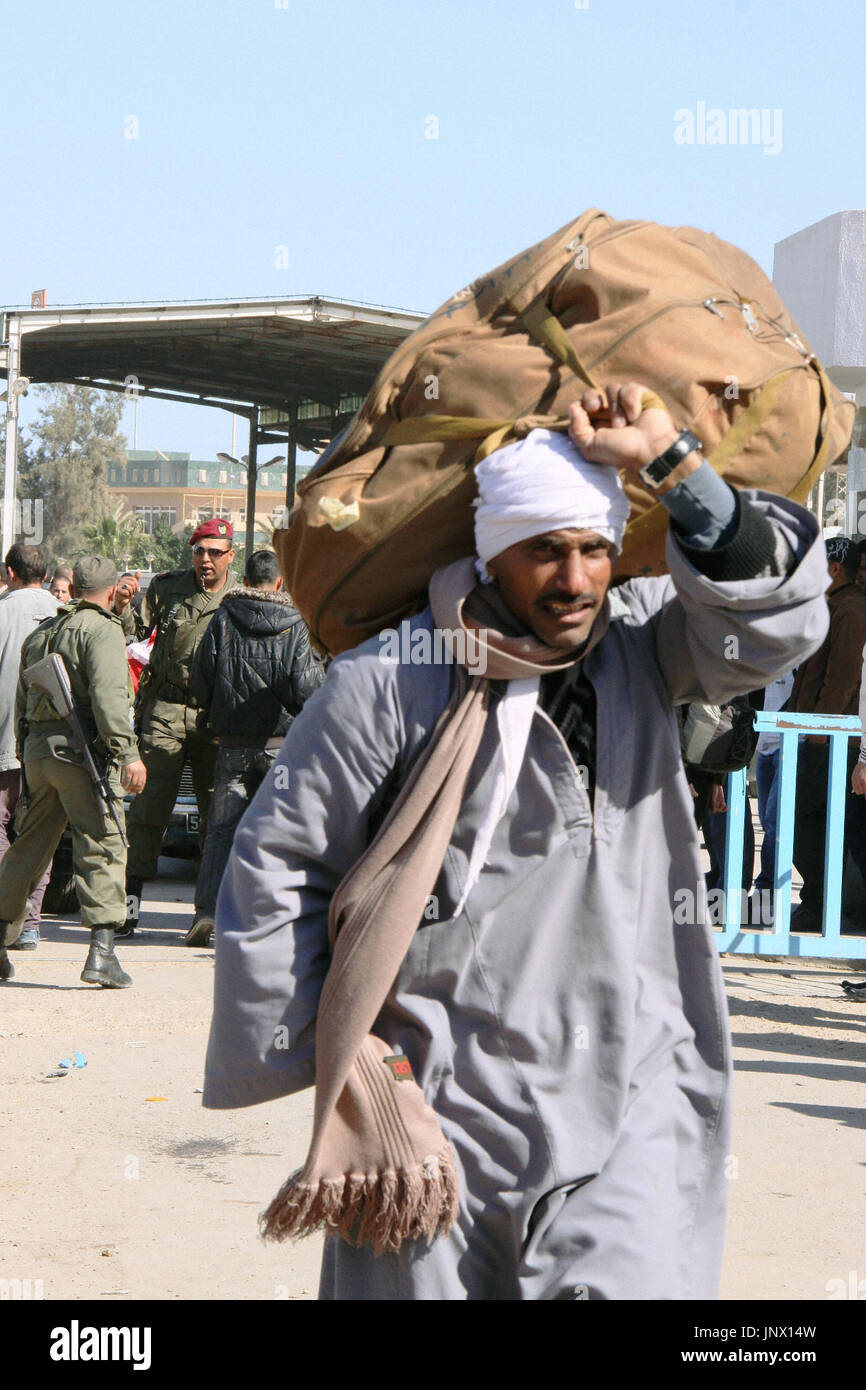 RASS AJDIR, Tunisia - A man escaping from Libya arrives in Rass Ajdir ...