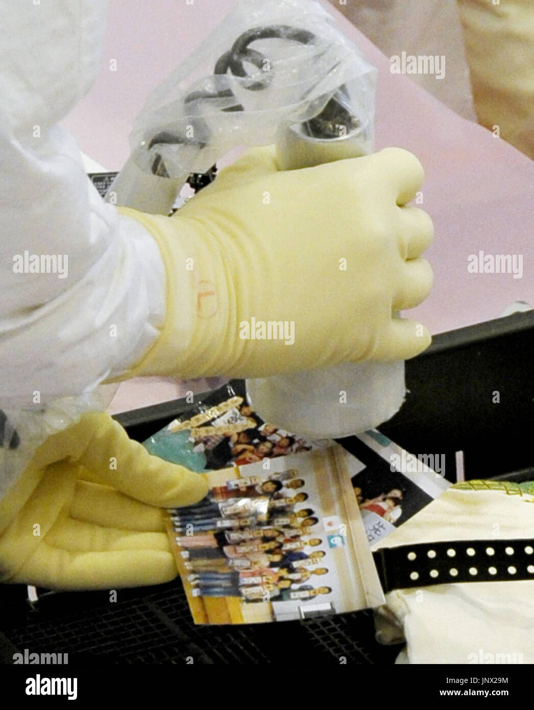 KAWAUCHI, Japan - Radiation levels are checked on photos taken back by ...