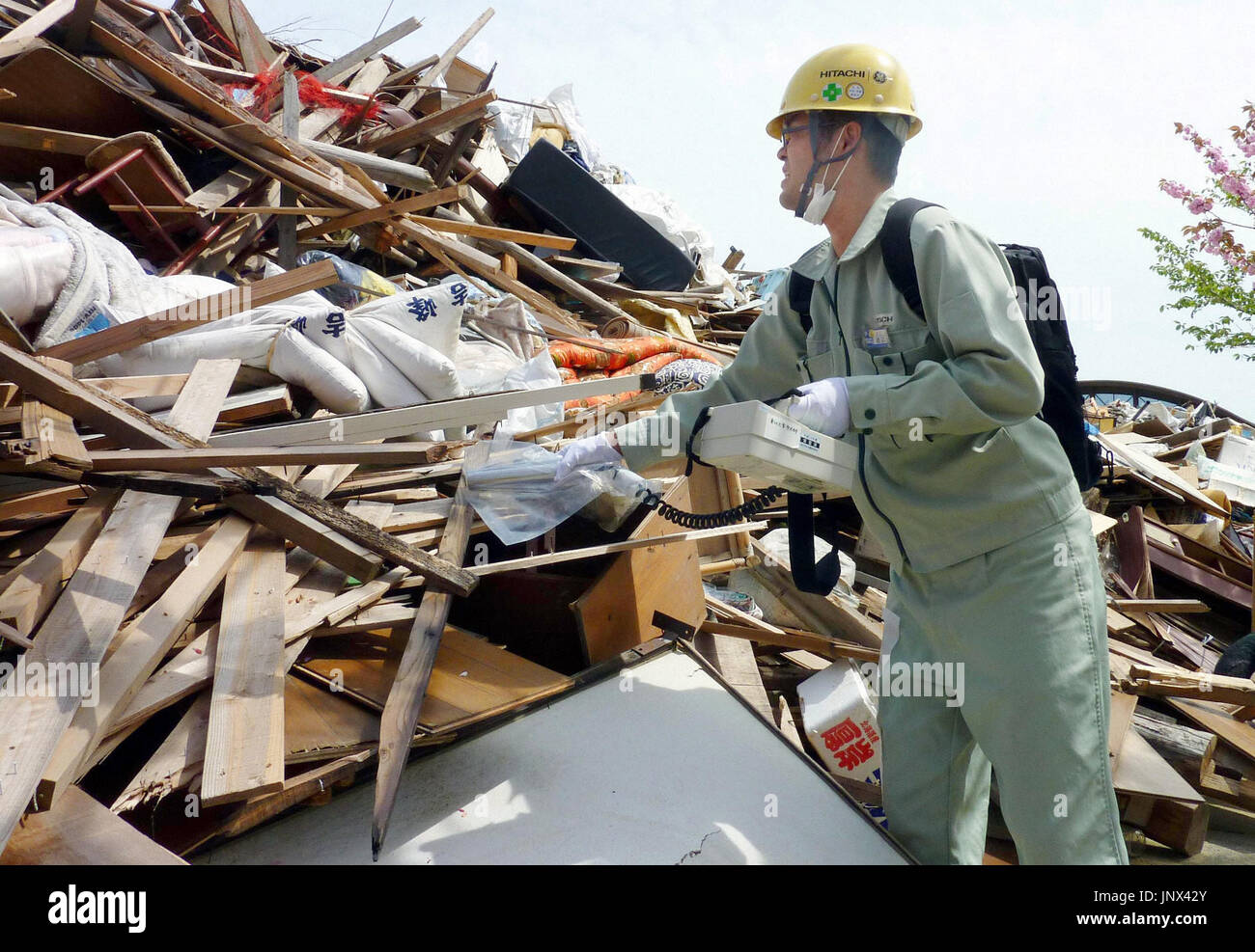 TOKYO, Japan - File photo shows a man measuring radiation levels at a ...