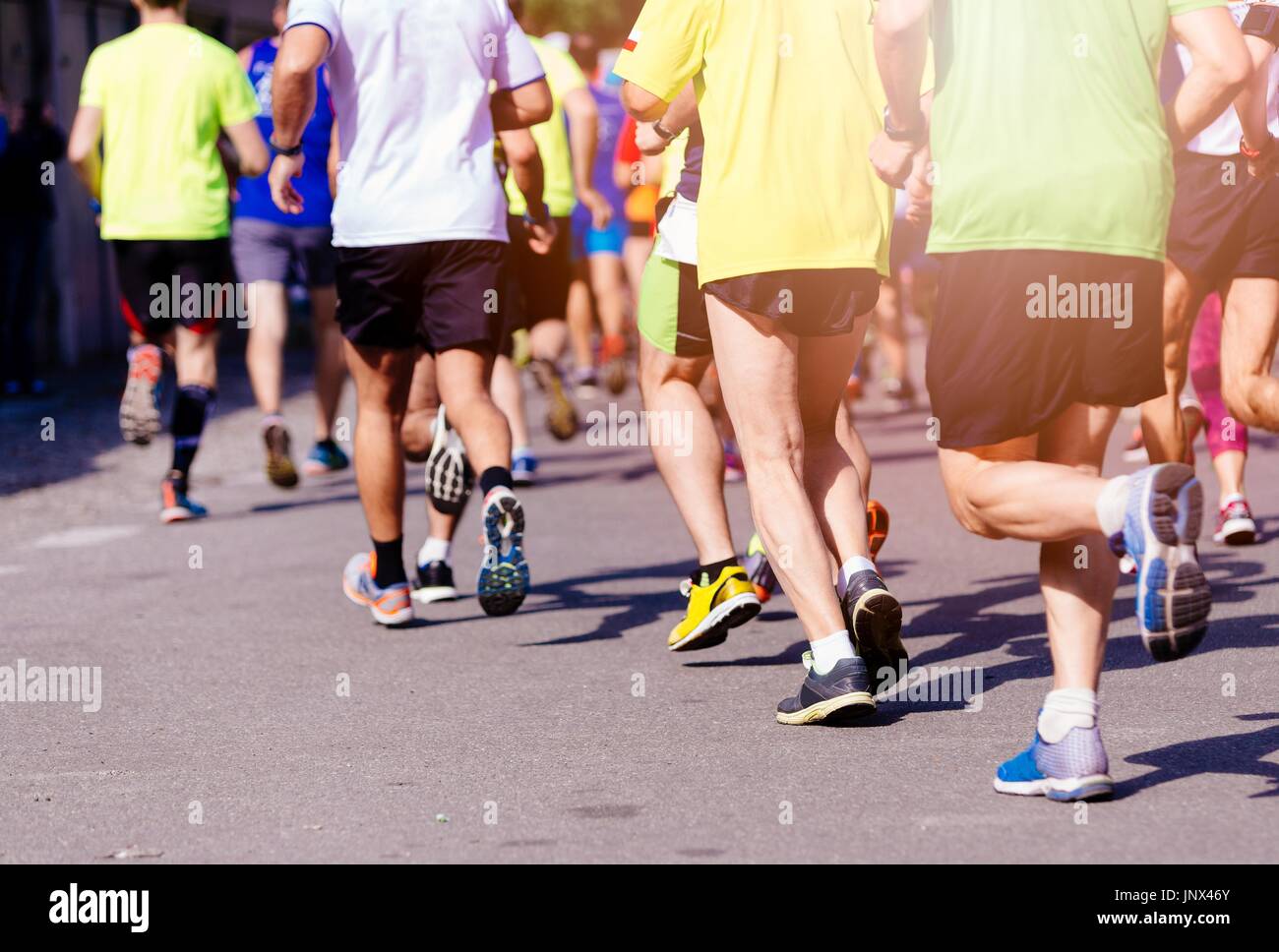 Marathon running street race, people feet on city road Stock Photo - Alamy