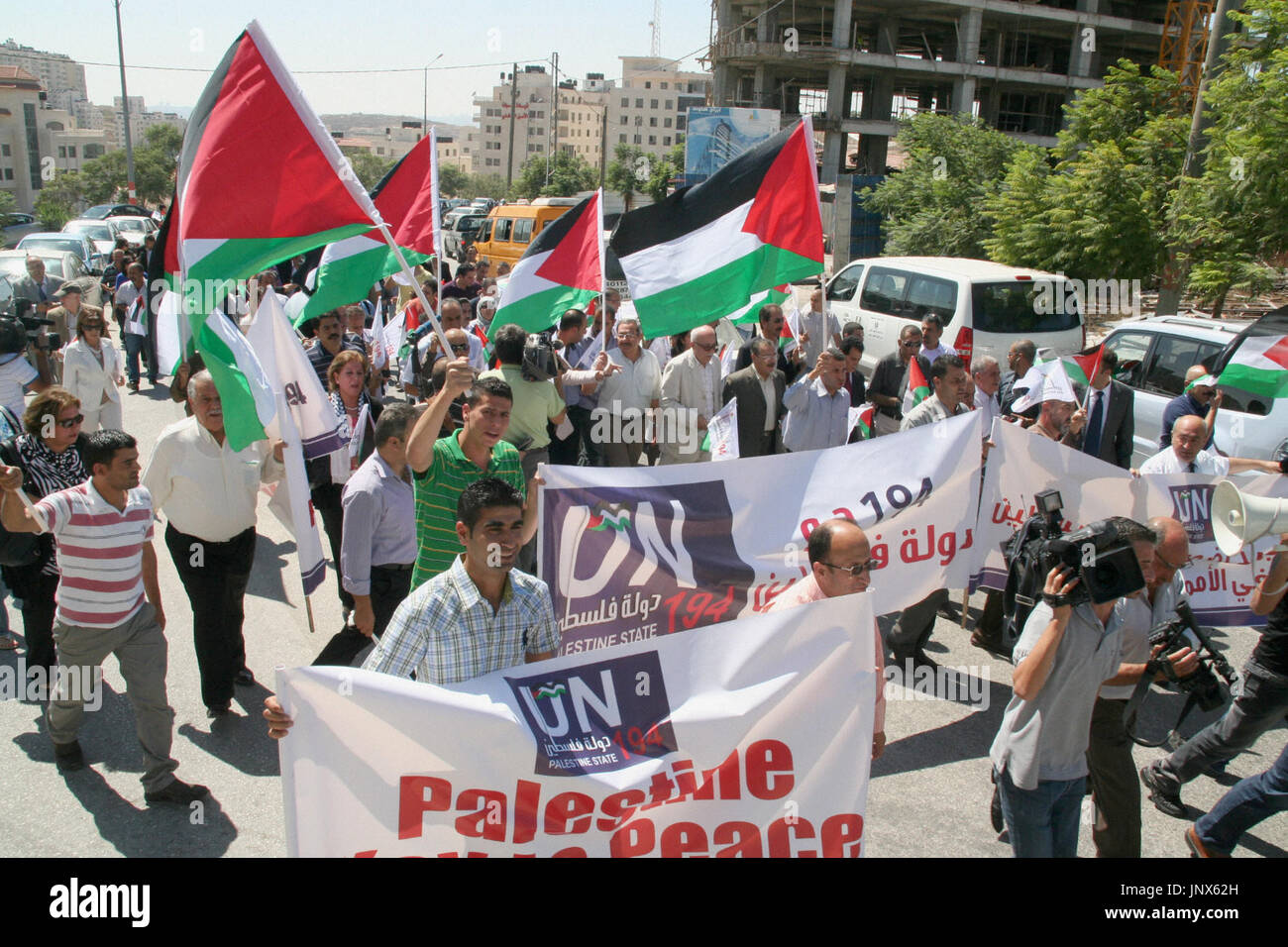 RAMALLAH, West Bank - About 100 people demonstrate in Ramallah, the ...