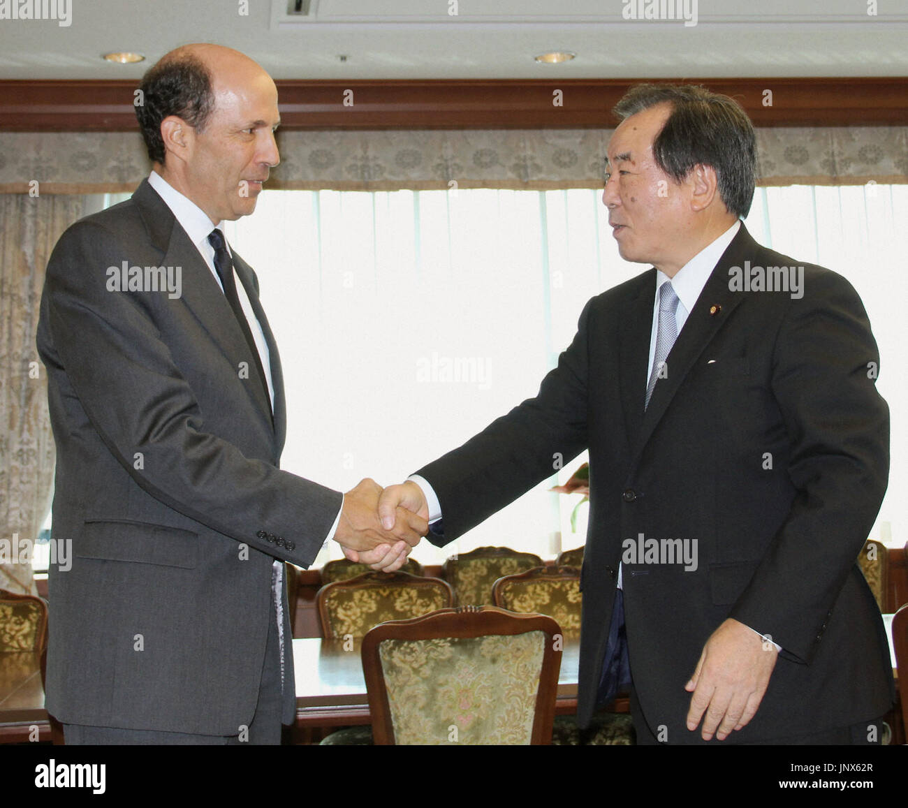 TOKYO, Japan - U.S. Ambassador to Japan John Roos (L) and Japan's new ...