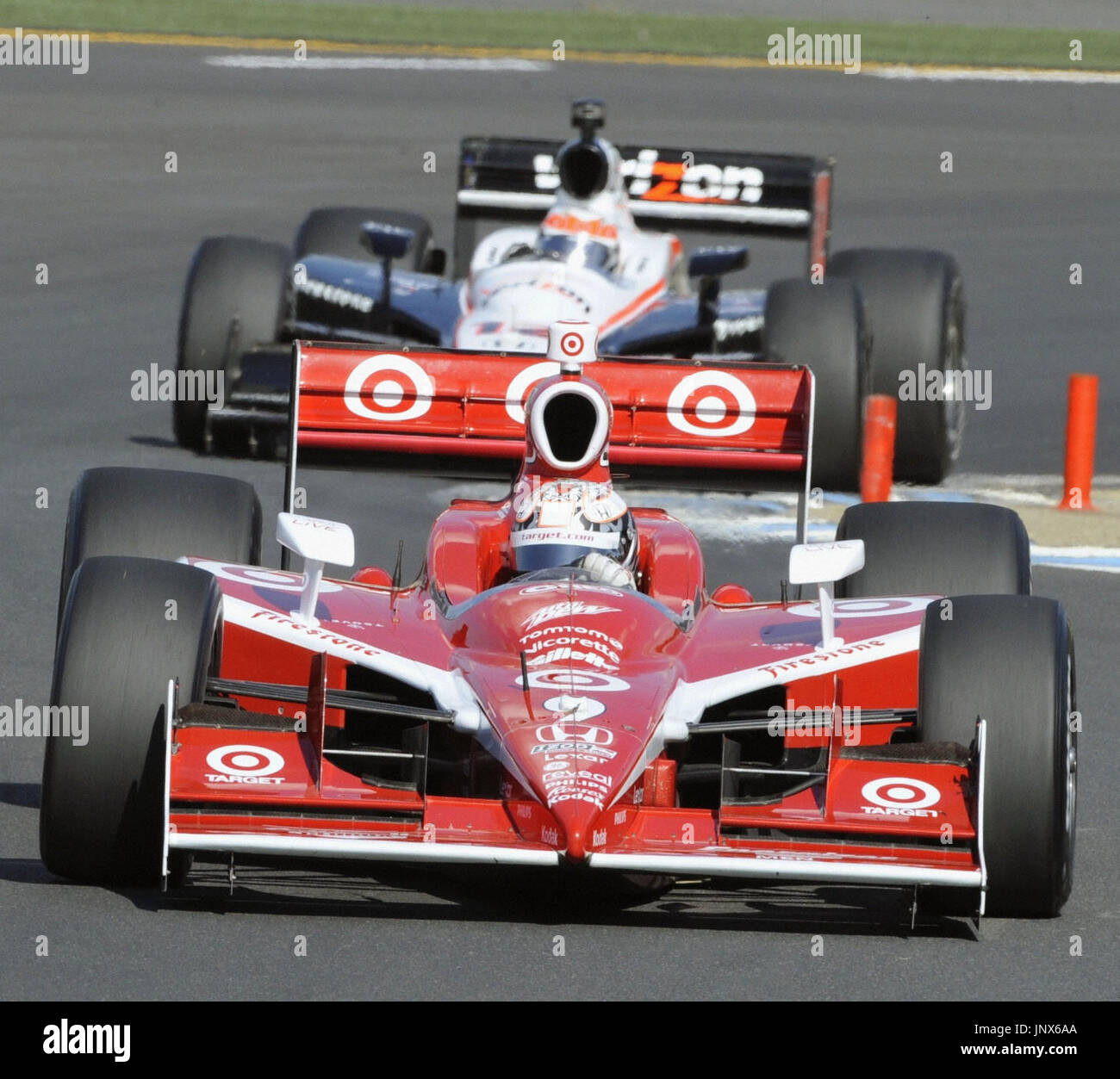 MOTEGI, Japan - The car driven by Scott Dixon of New Zealand (front) is ...