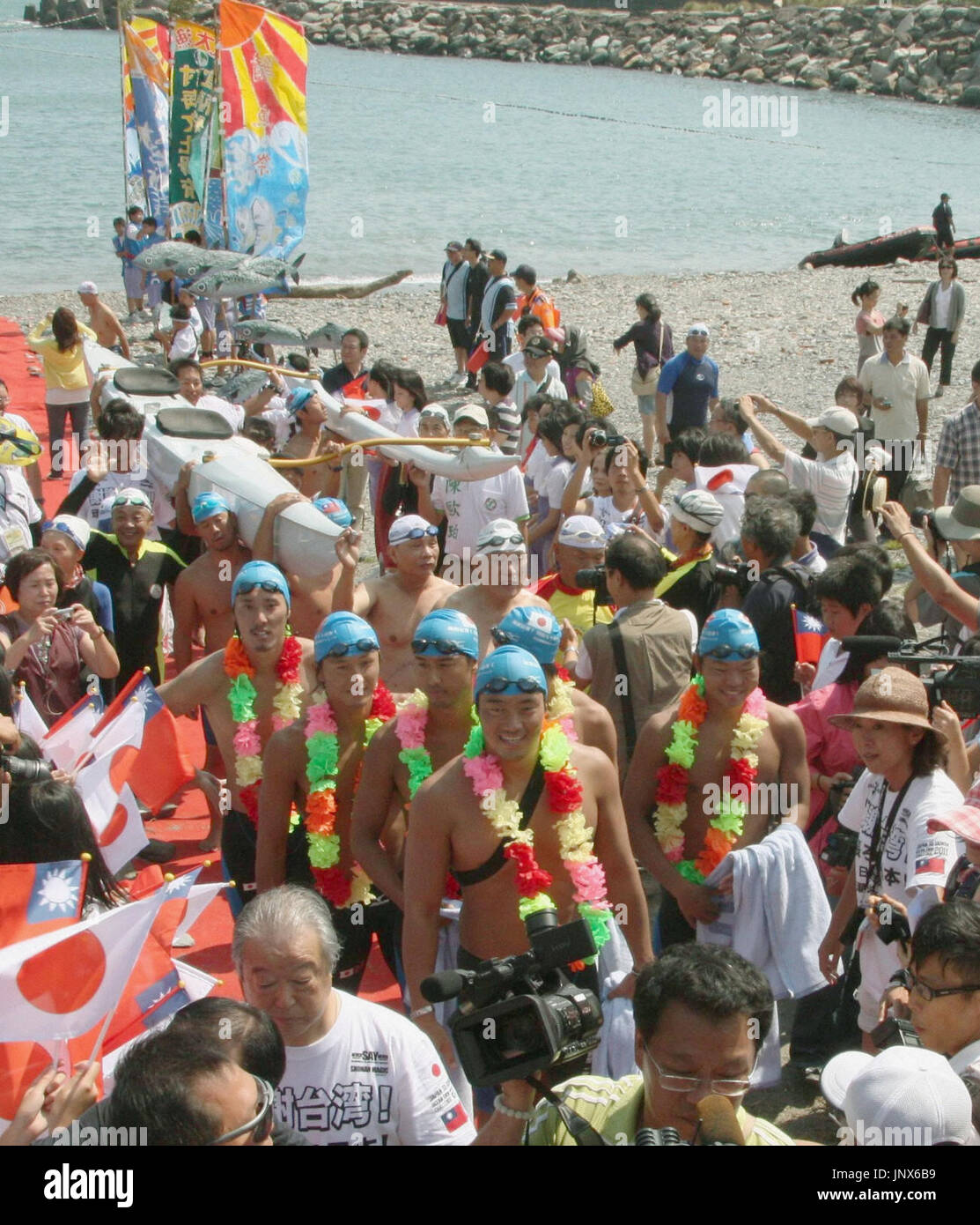 SU-AO, Taiwan - A team of six Japanese swimmers (in blue swimming caps ...