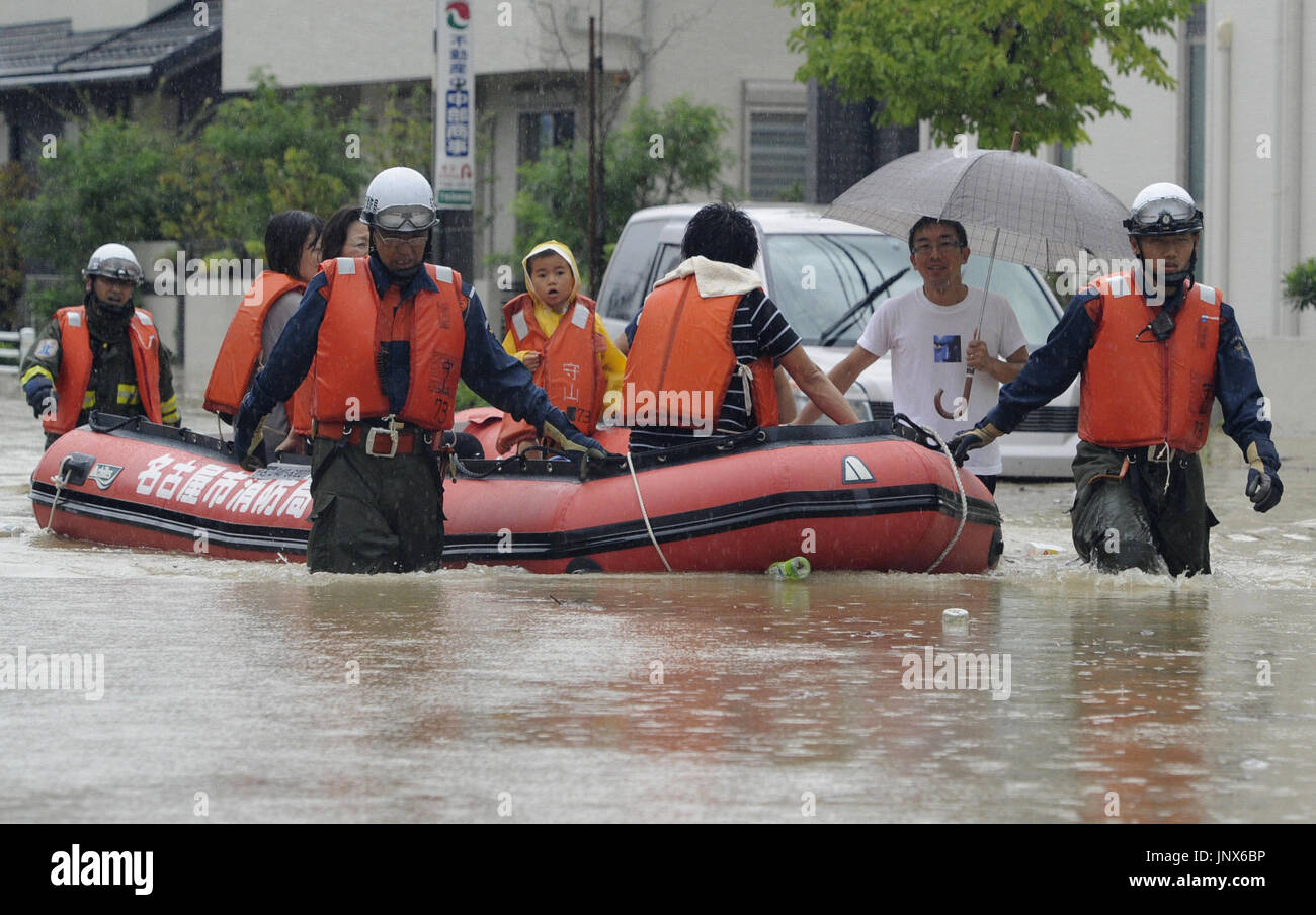 NAGOYA, Japan - People evacuate by foot and raft accompanied by rescue ...