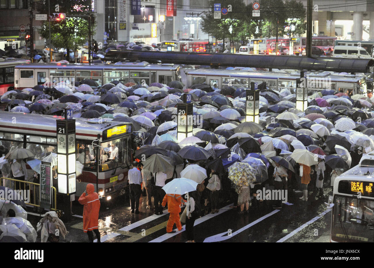 TOKYO, Japan - People swarm at bus stands in front of JR Shibuya ...