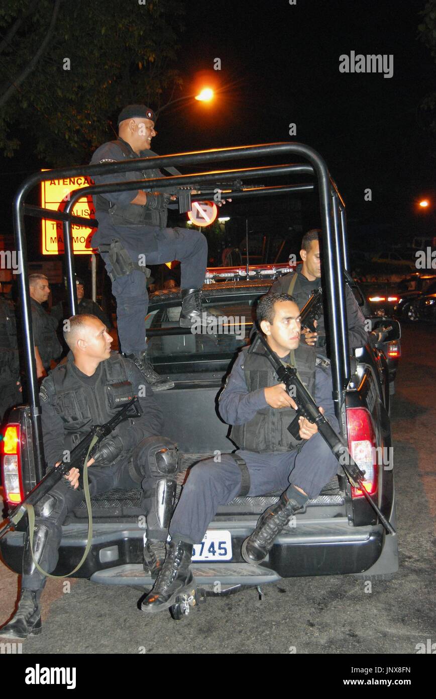 RIO DE JANEIRO, Brazil - Brazilian police officers aboard a vehicle are ...