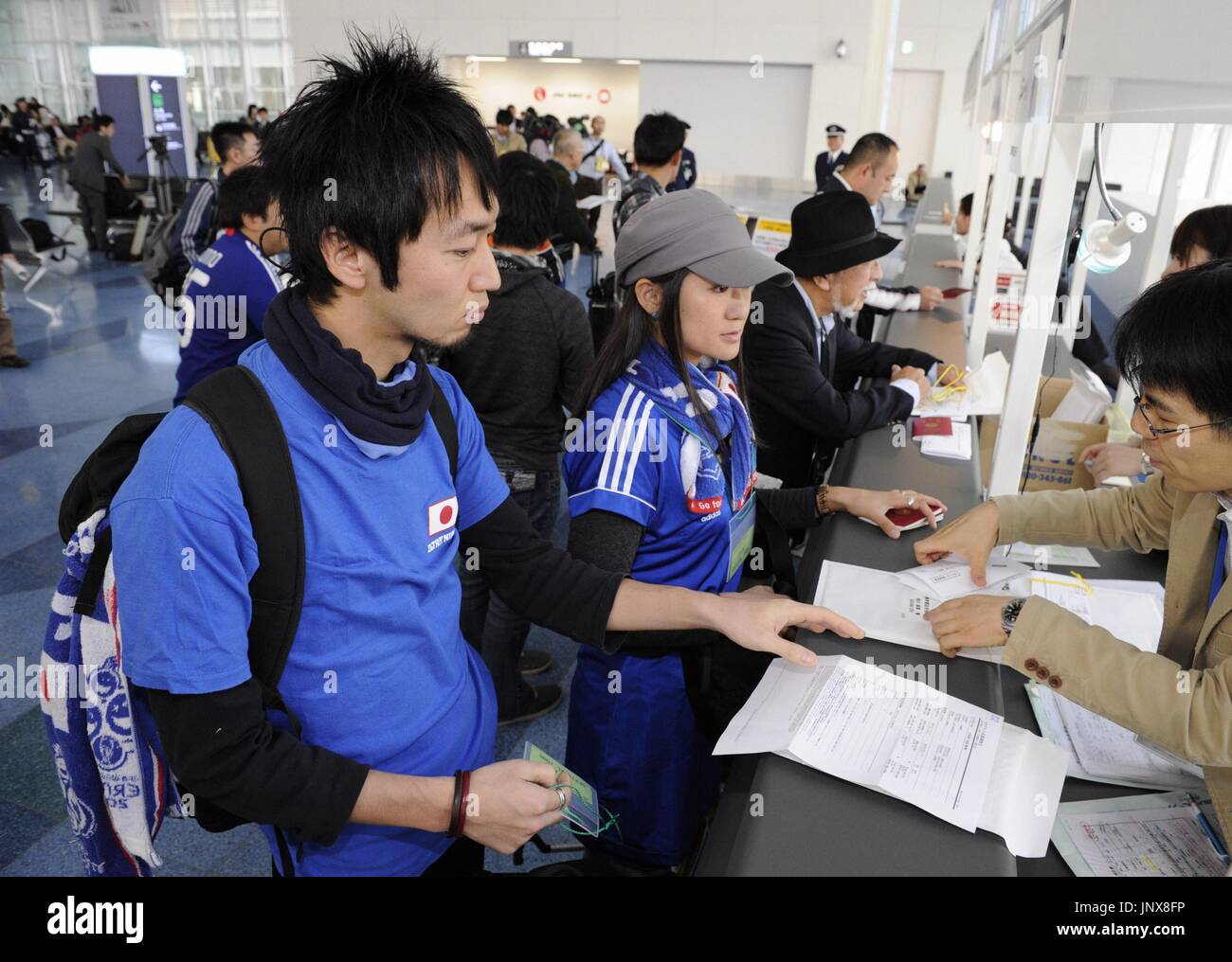 TOKYO, Japan - Japan supporters line up at check-in counters of Tokyo's ...