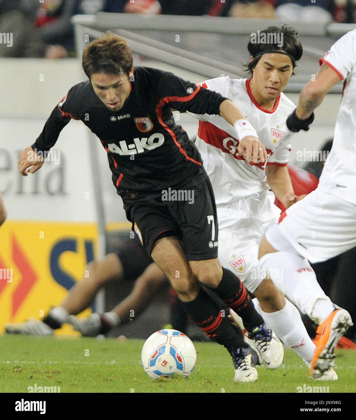 STUTTGART, Germany - Japanese footballers Hajime Hosogai of Augsburg ...