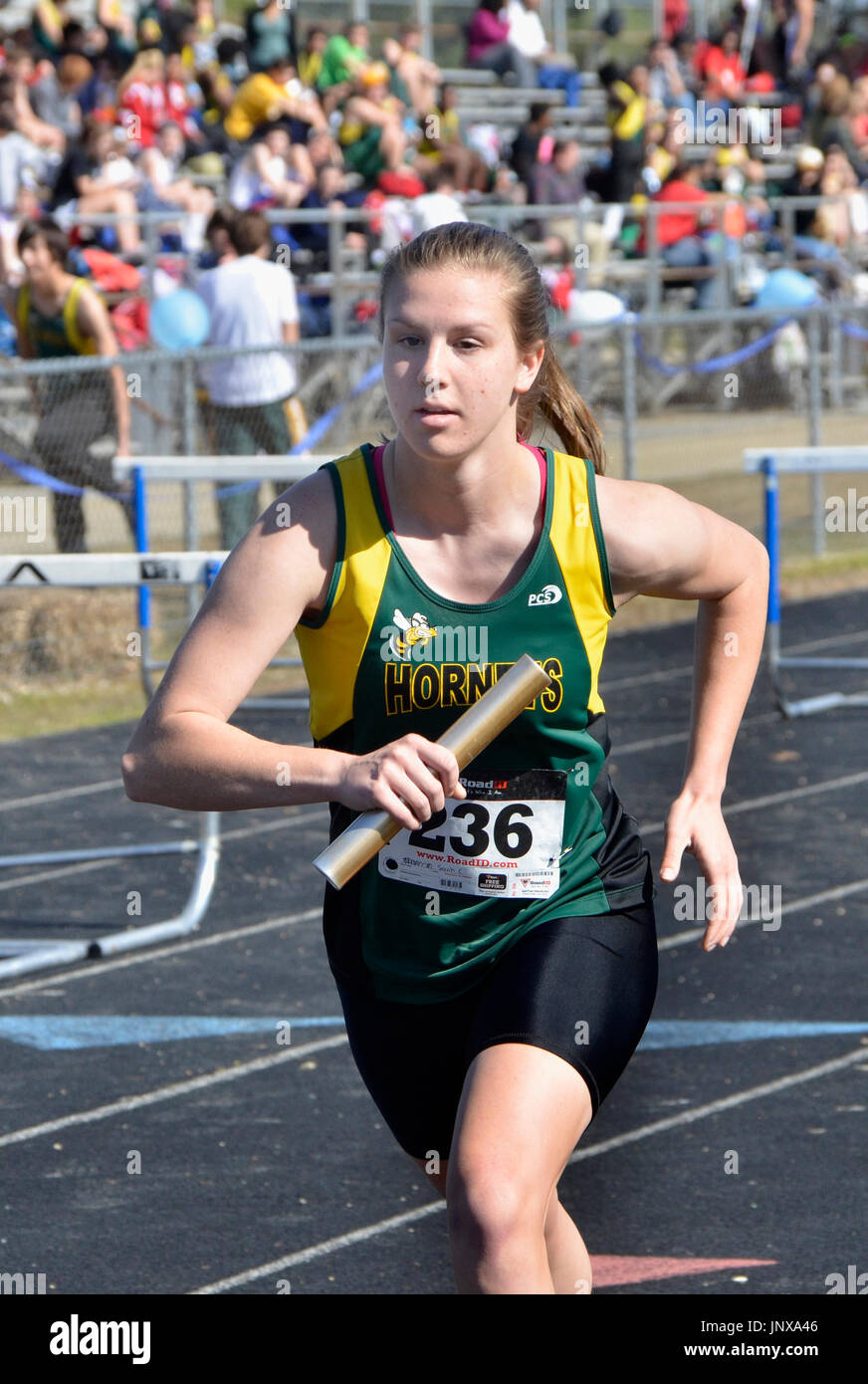 Girl running in the relay race hi-res stock photography and images - Alamy