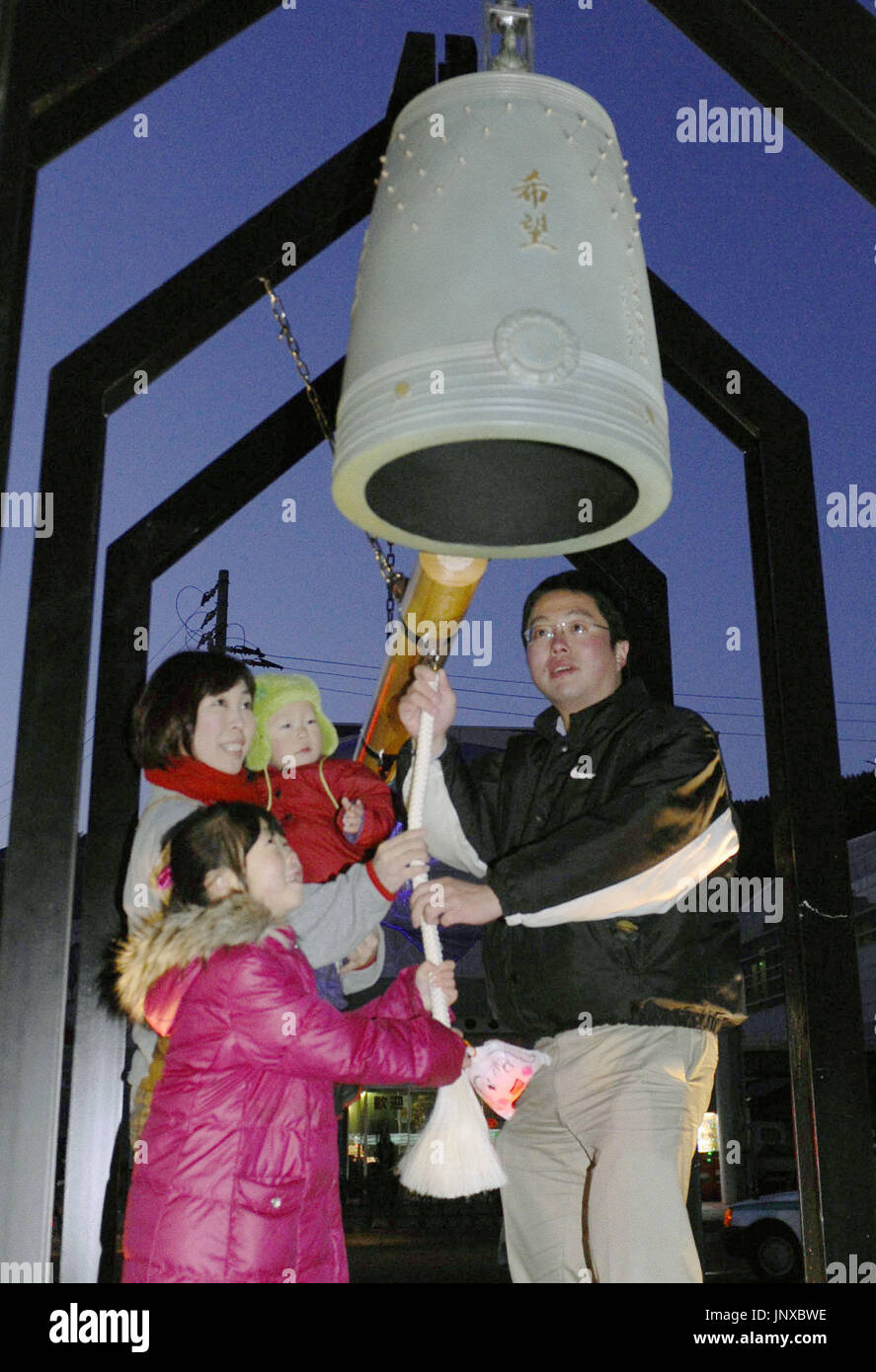 KAMAISHI, Japan - A family tolls the ''Kamaishi Reconstruction Bell ...