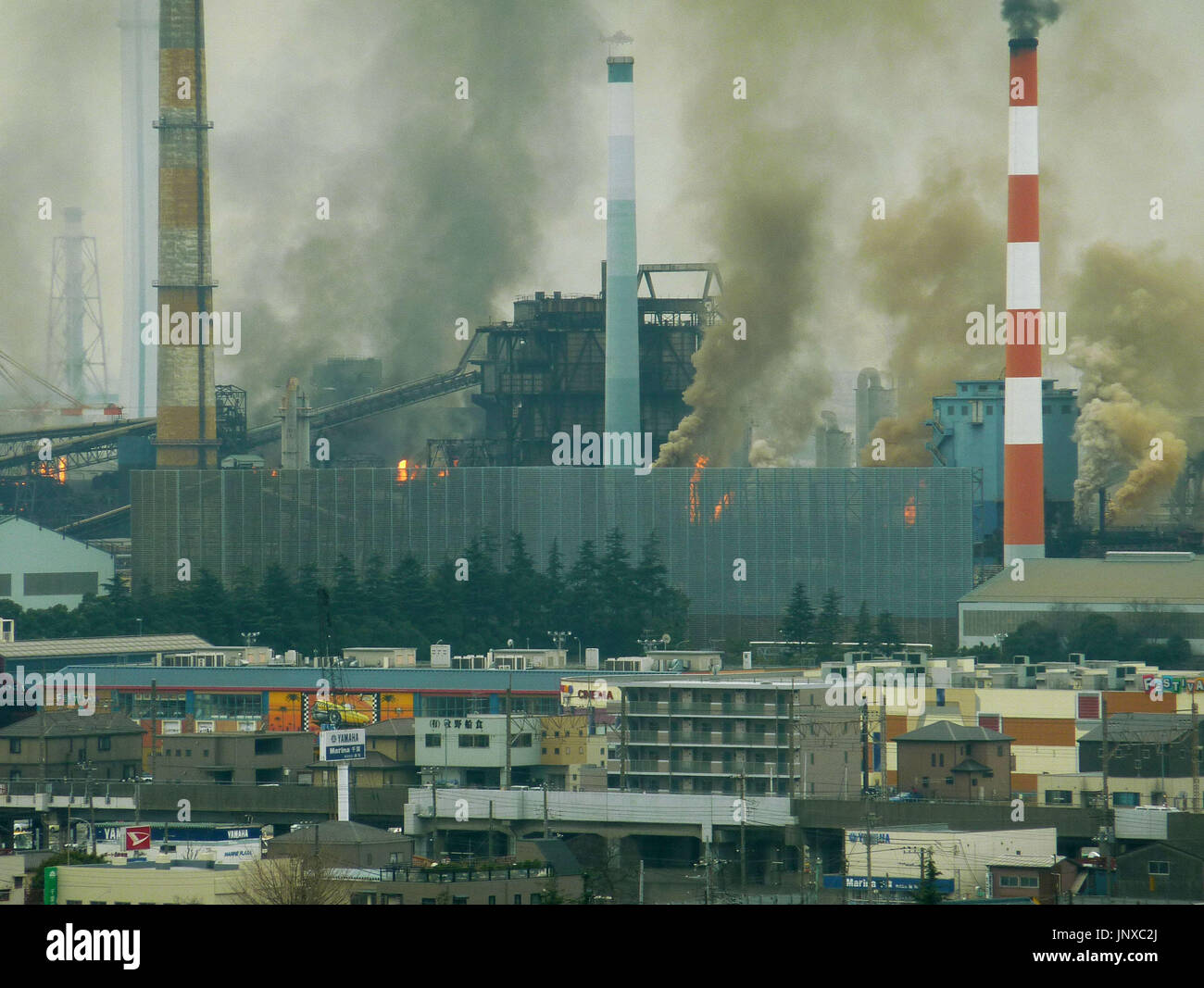 CHIBA, Japan - Columns of smoke rise due to fire at a plant of JFE ...