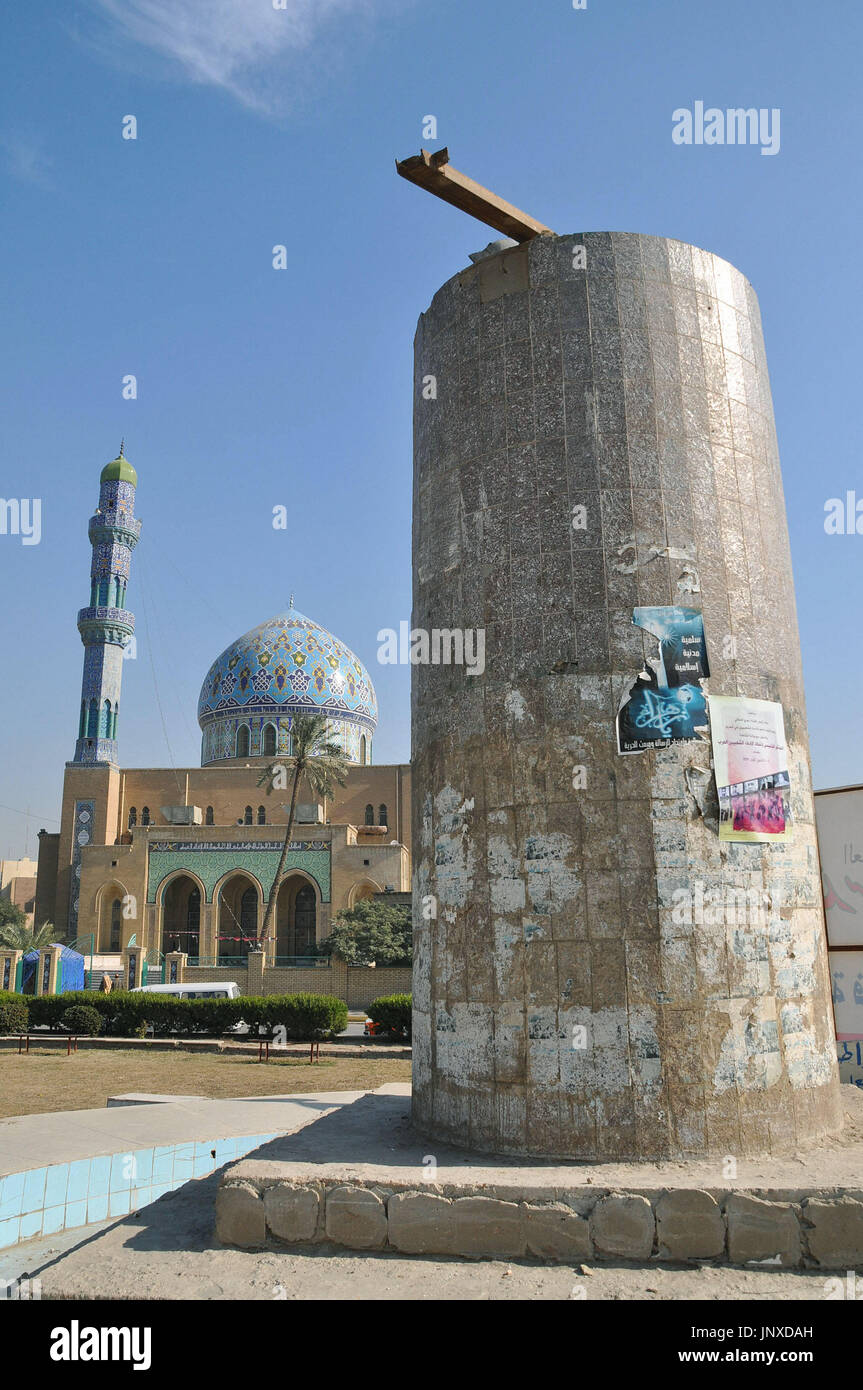 BAGHDAD, Iraq - Only the base of a statue of former Iraqi President ...