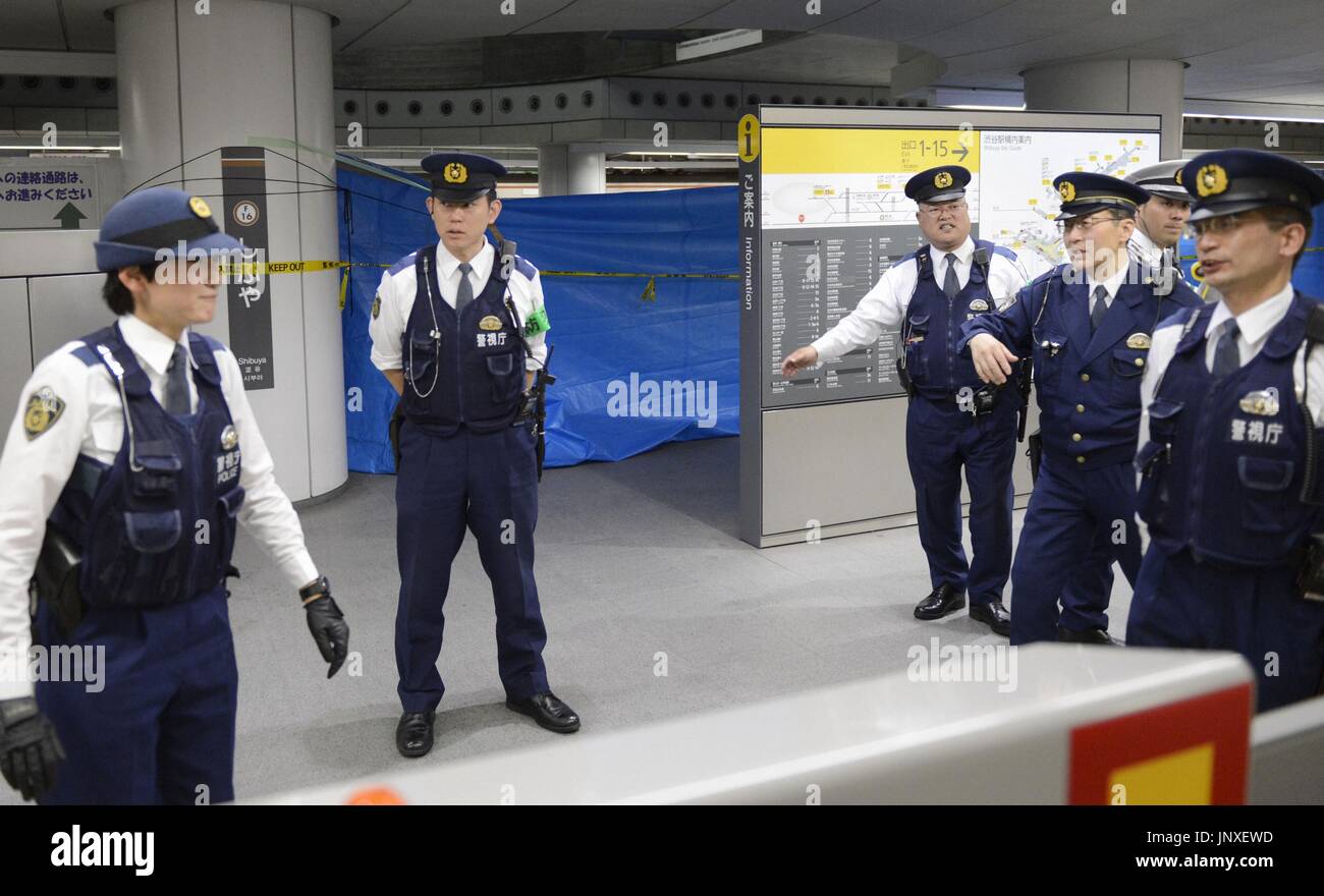 TOKYO, Japan - Police officers keep watch inside the Tokyo Metro ...