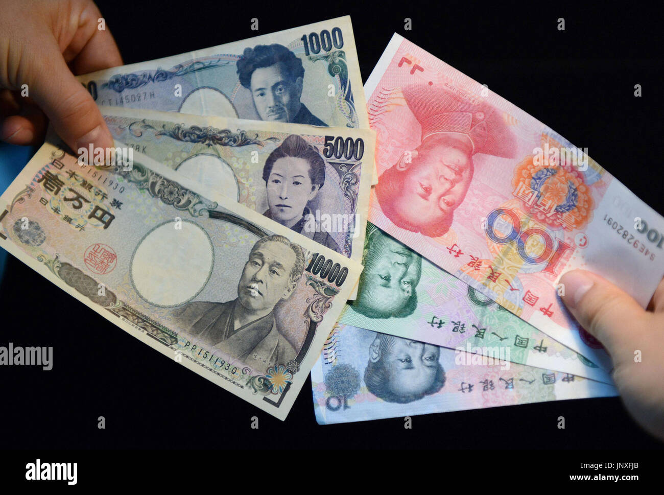 BEIJING, China - Photo shows bills in yen (L) and yuan. Direct trading ...