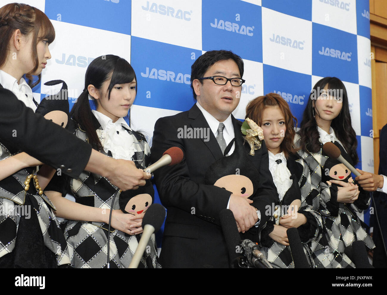 TOKYO, Japan - Yasushi Akimoto (C), producer of the Japanese all-girl ...