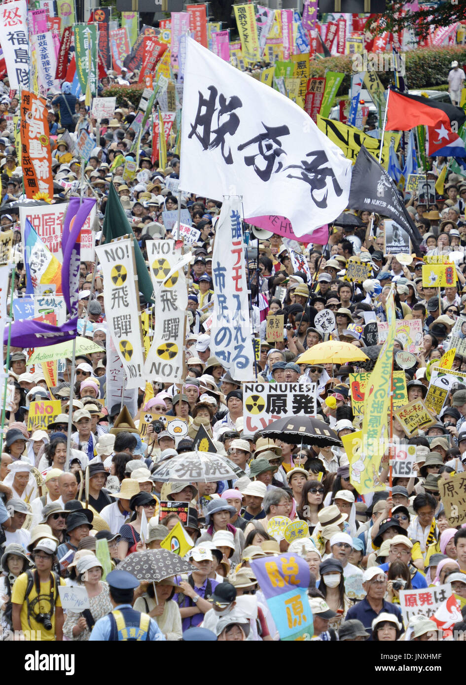 TOKYO, Japan - People parade in an anti-nuclear power plant rally in ...