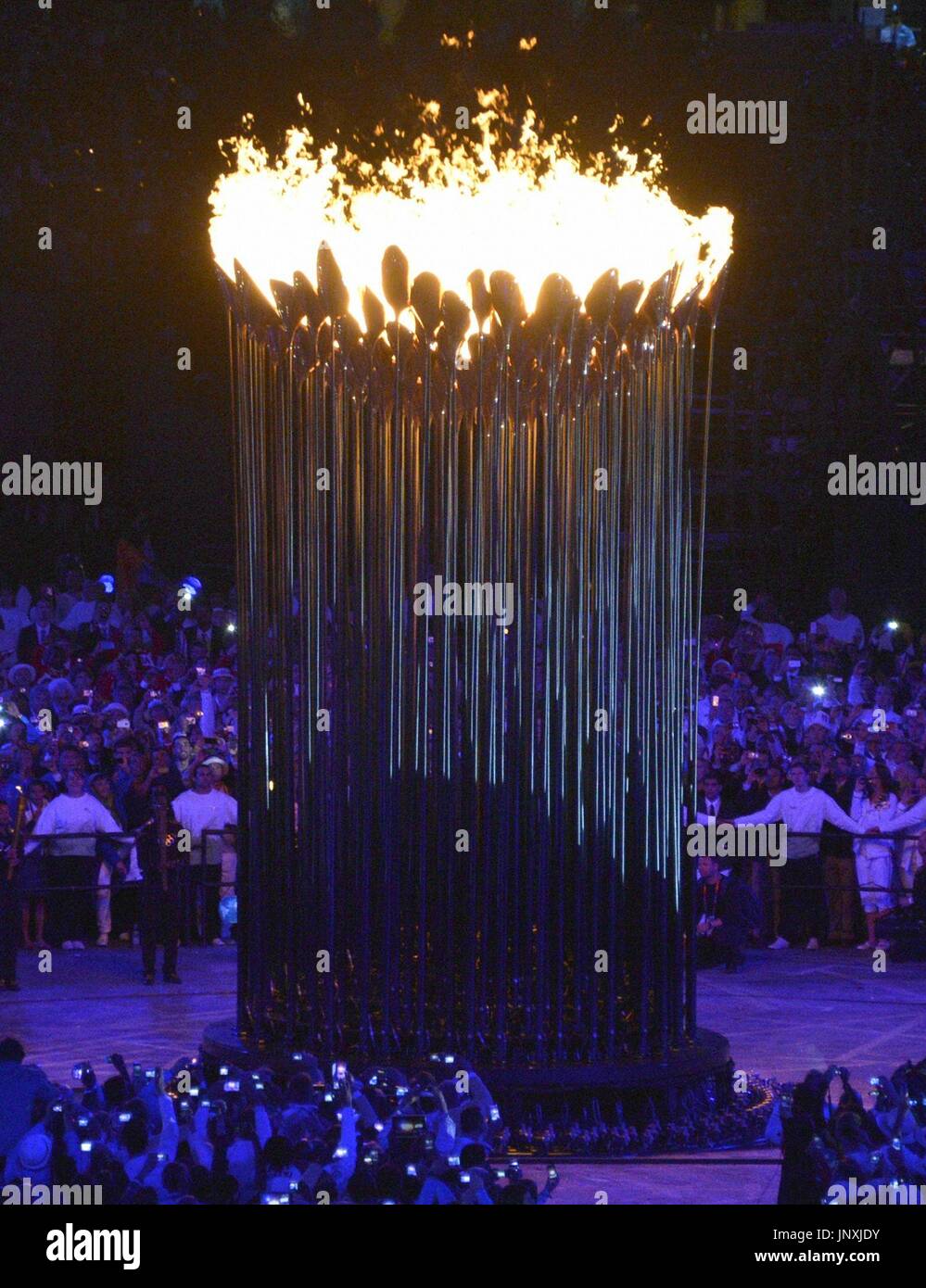 LONDON, Britain - The Olympic flame is burning at the center of the ...
