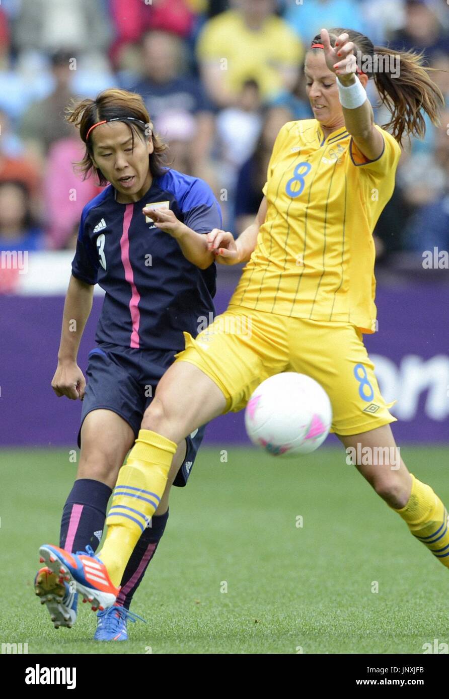 COVENTRY, Britain - Japan's Asuza Iwashimizu (L) marks Sweden's Lotta ...