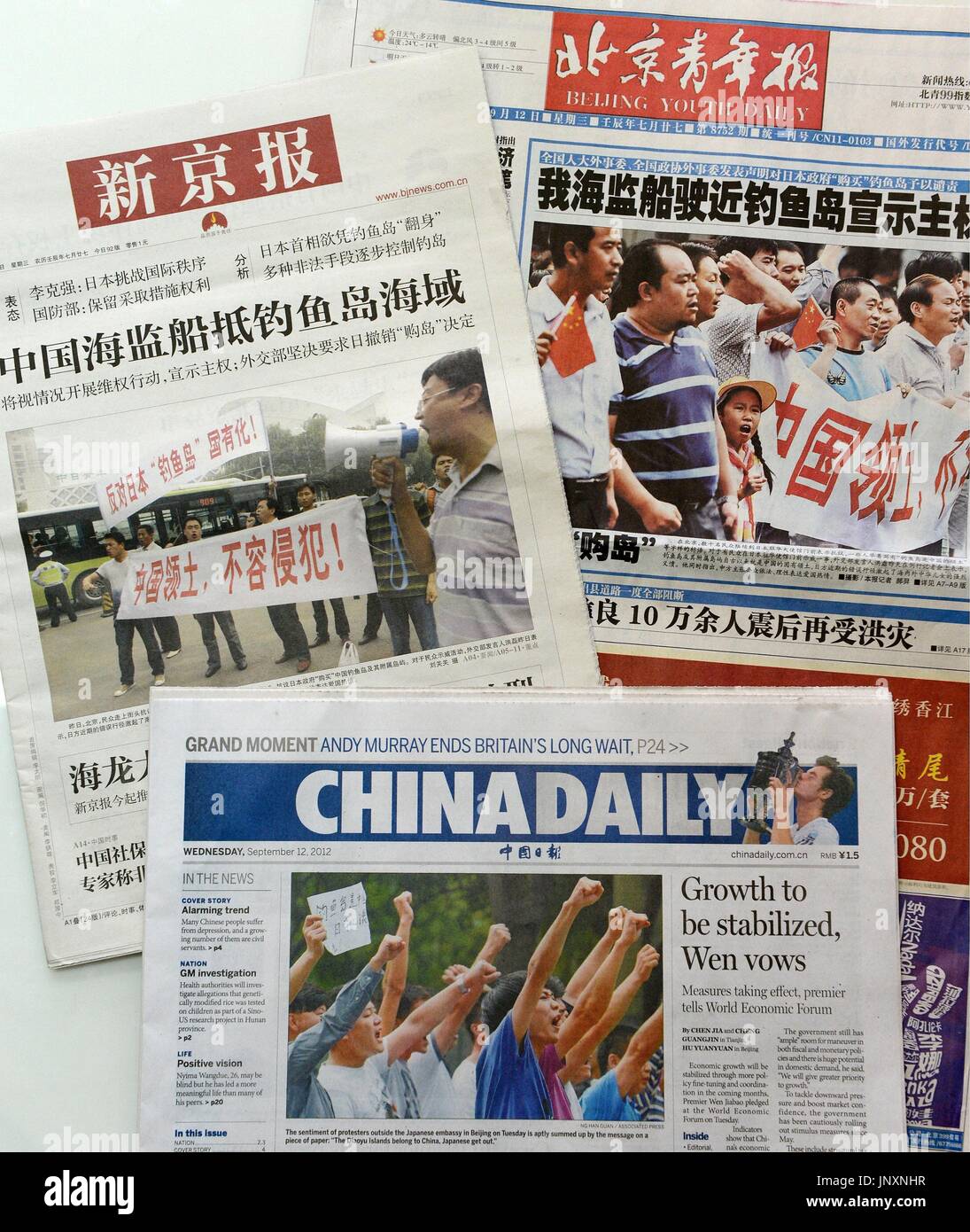 BEIJING, China - Photo shows the front pages of several Chinese ...