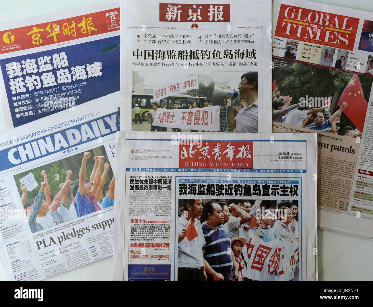 BEIJING, China - Photo shows the front pages of several Chinese ...