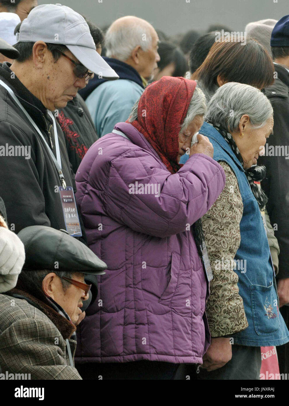 NANJING, China - People observe a moment of silence during a ceremony ...