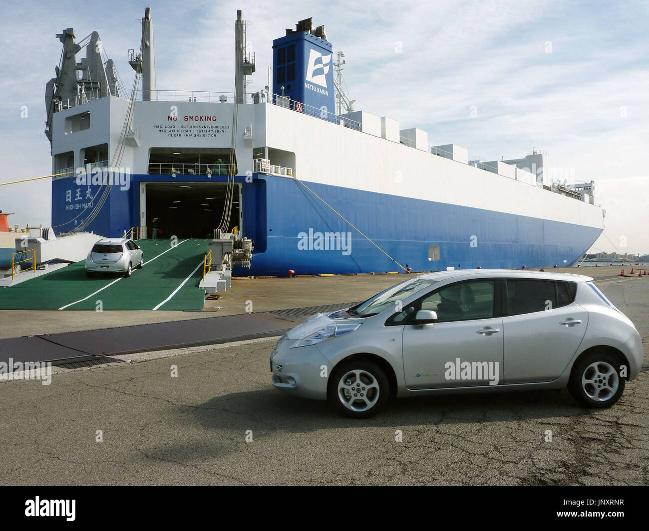 TOKYO, Japan - Nissan Motor Co. shows a new car carrier (back) equipped ...