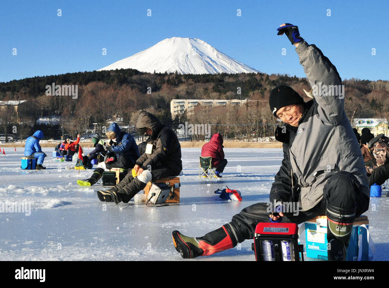 KOFU, Japan - People take part in ice fishing on frozen Lake Yamanaka ...