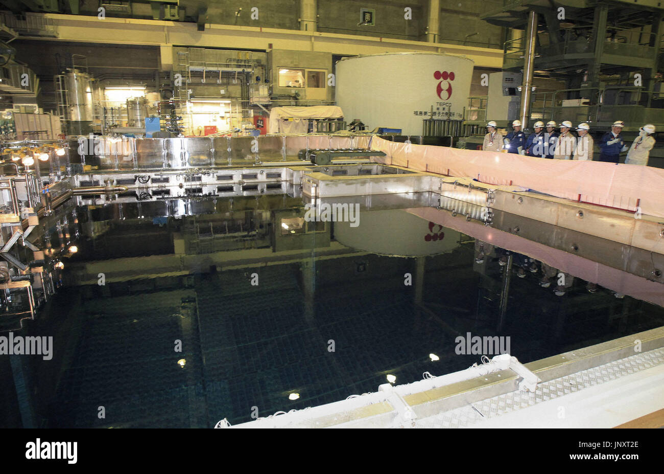 FUKUSHIMA, Japan - Local government officials examine a spent fuel pool ...