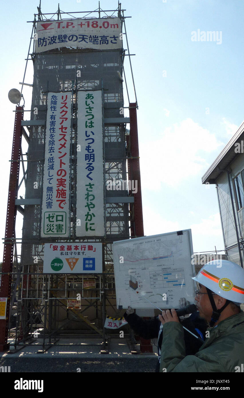 OMAEZAKI, Japan - A Chubu Electric Power Co. official explains about a ...