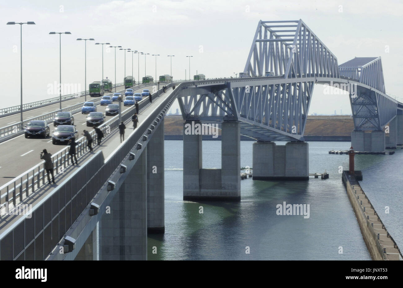TOKYO, Japan - Electric vehicles and other eco-cars pass Tokyo Gate ...