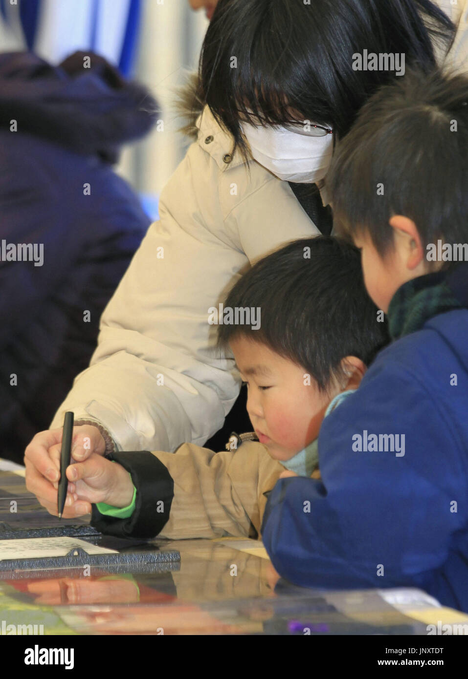 TOKYO, Japan - People write goodwill messages for Emperor Akihito at a ...
