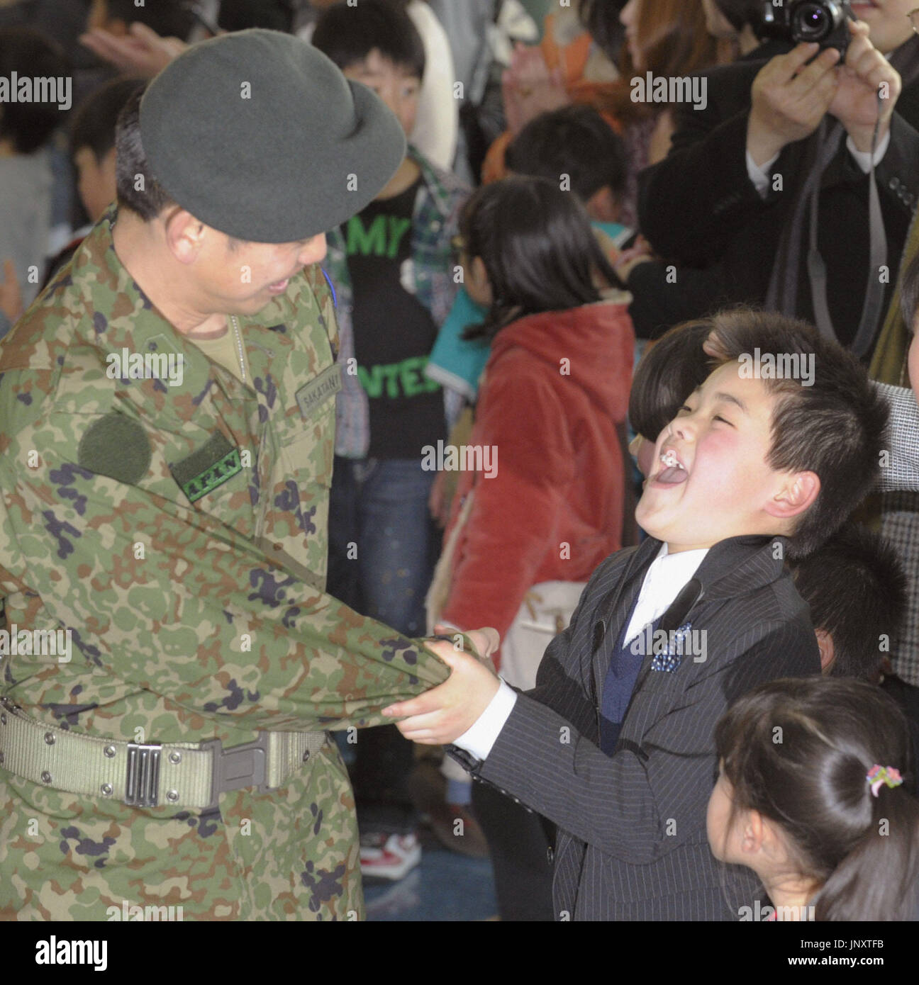 TOKYO, Japan - Relatives see Ground Self-Defense Force engineers off at ...