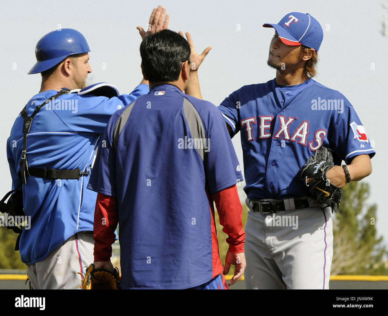 SURPRISE, United States - Texas Rangers rookie Yu Darvish (R) and ...
