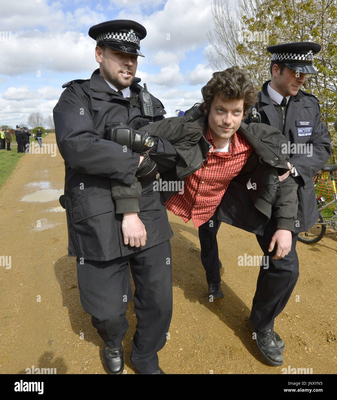 LONDON, Britain - Police officers evict a man who had blocked a ...