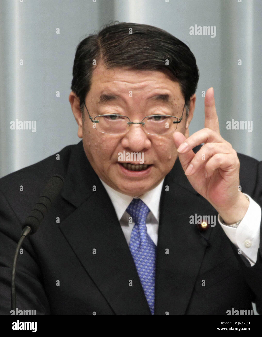 TOKYO, Japan - Chief Cabinet Secretary Osamu Fujimura tells a news ...