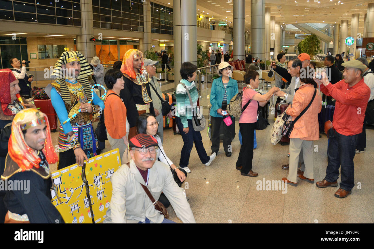 CAIRO, Egypt - Japanese tourists take photos with dancers wearing ...