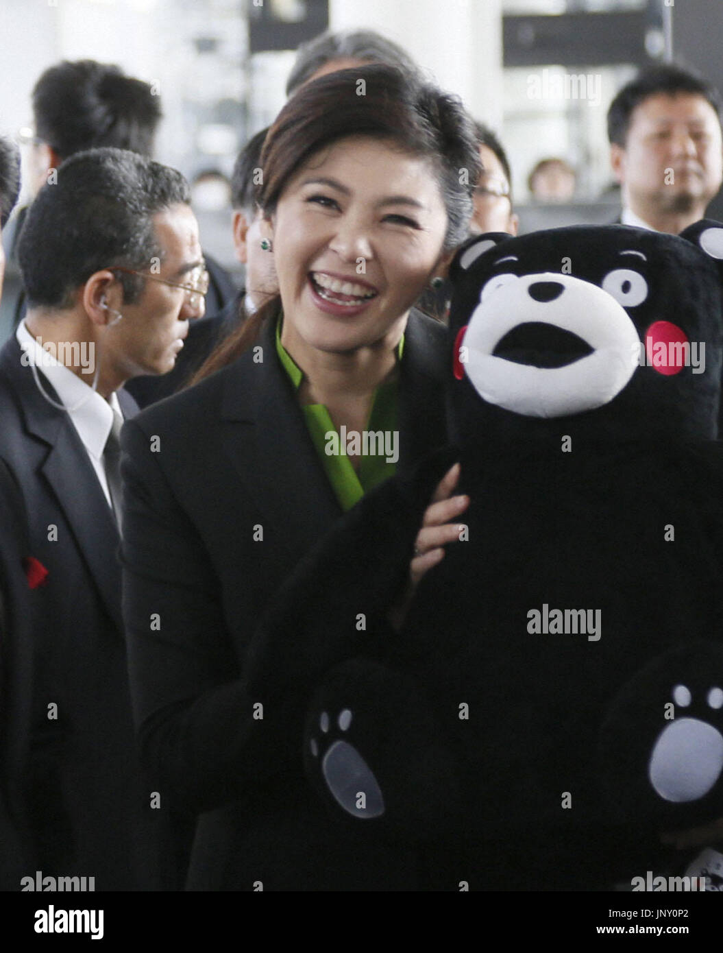 FUKUOKA, Japan - Thai Prime Minister Yingluck Shinawatra smiles with ...