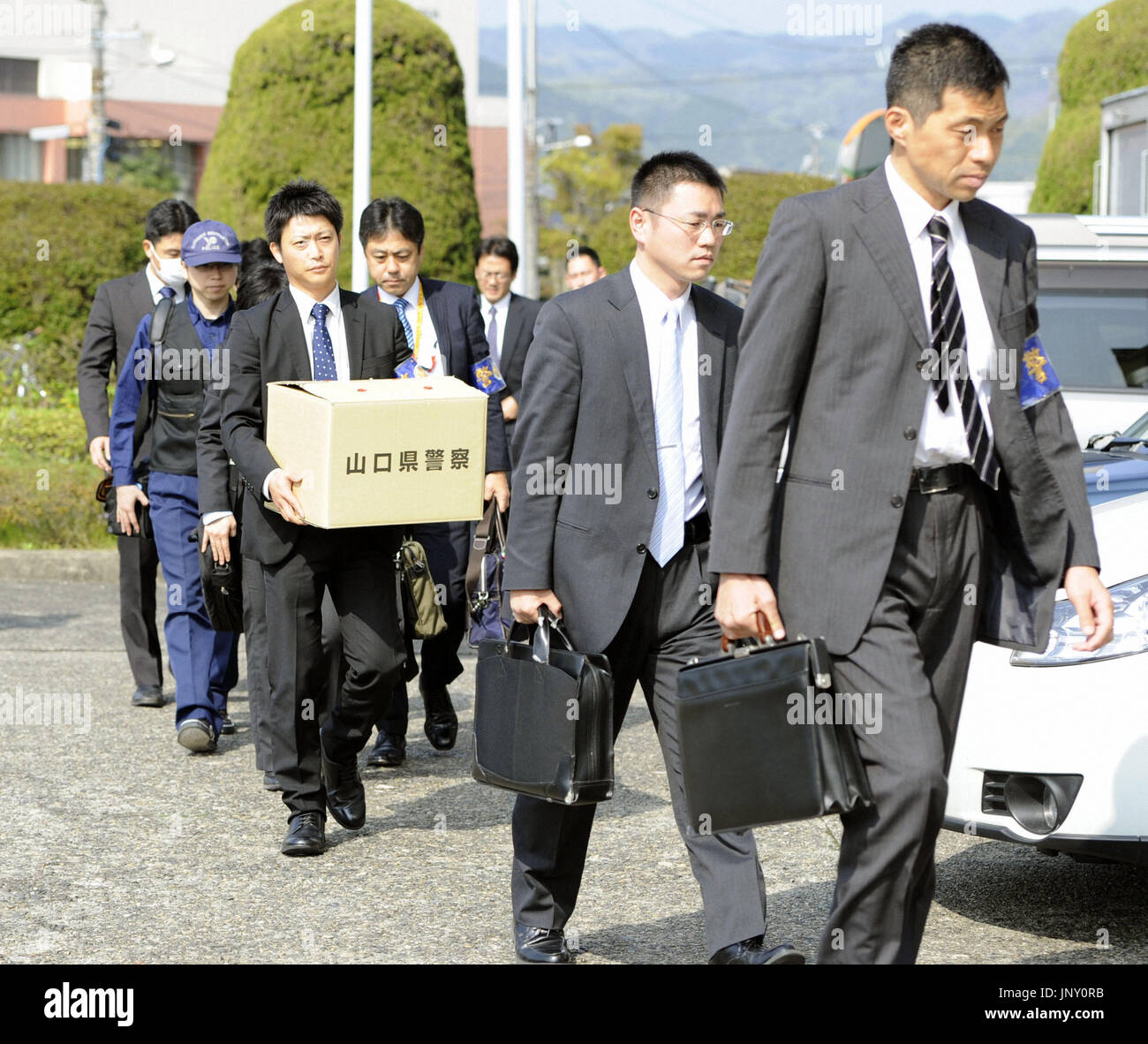 YAMAGUCHI, Japan - Police officers enter a glue factory of Mitsui ...