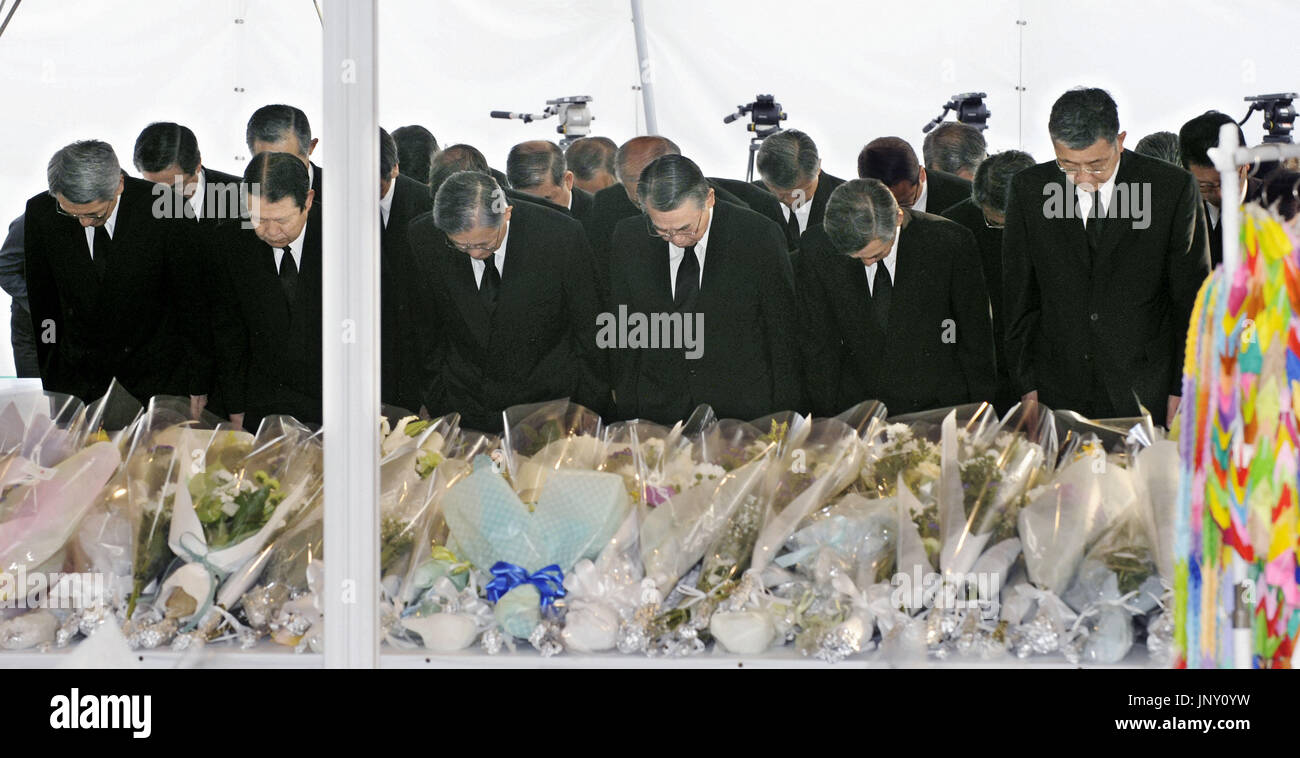 OSAKA, Japan - West Japan Railway Co. President Takayuki Sasaki (3rd from R front) and other ...