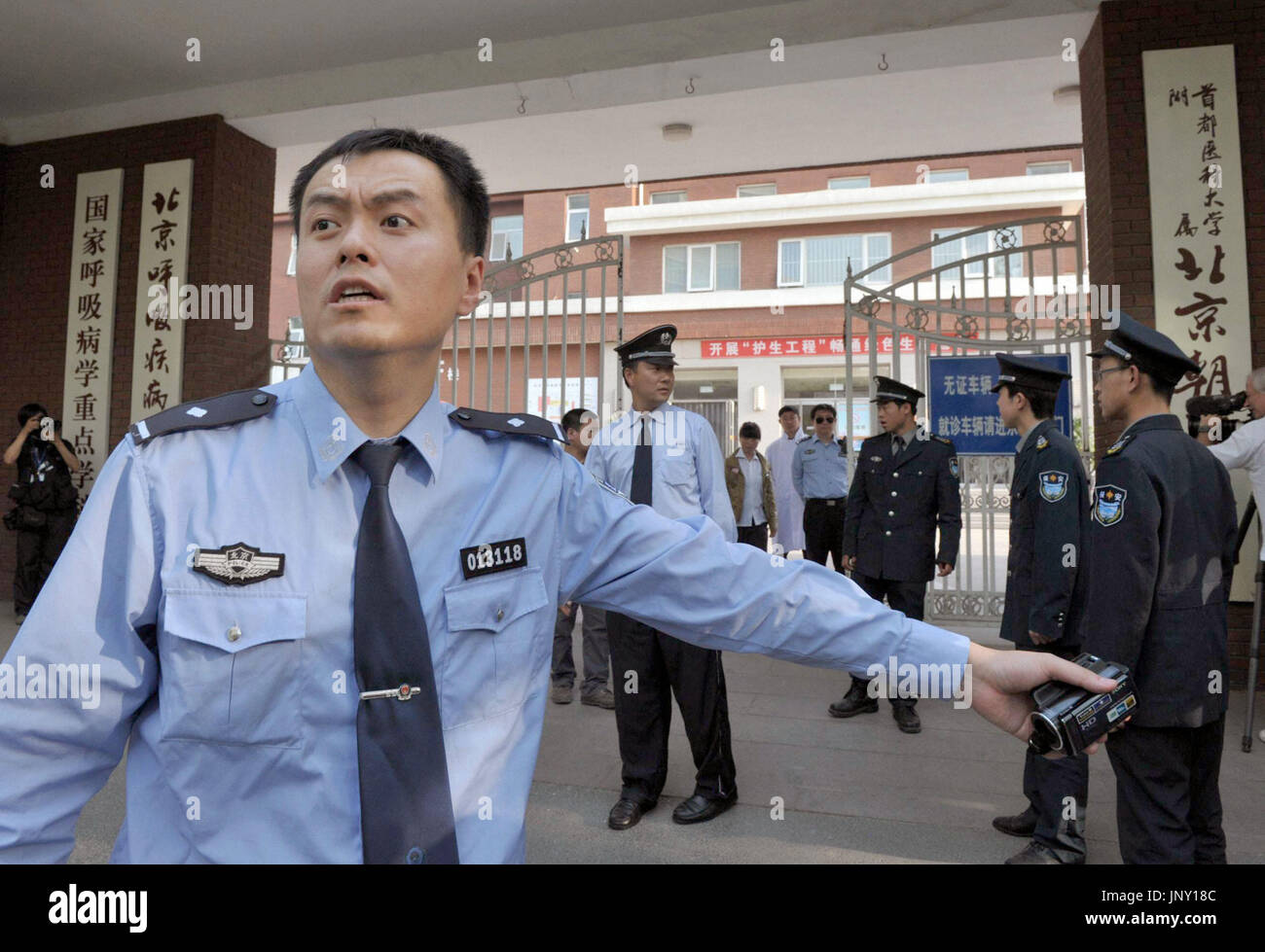 BEIJING, China - Security police officers on May 2, 2012, prevent ...