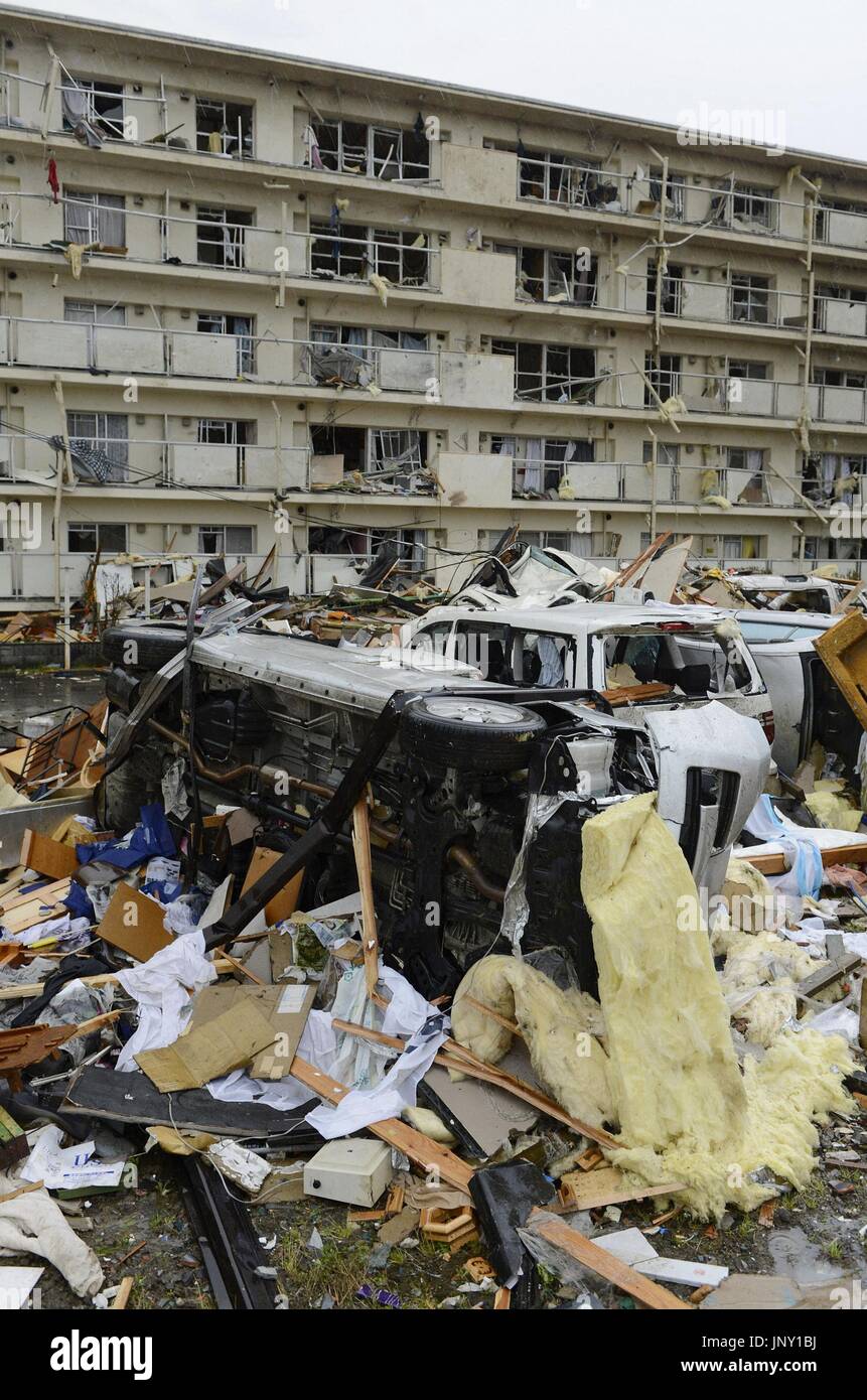 TSUKUBA, Japan - Photo shows an overturned vehicle and a damaged ...